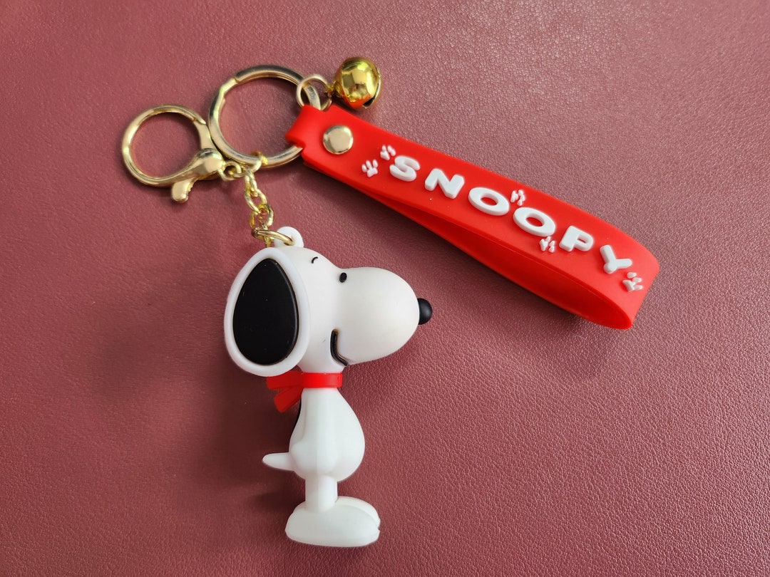 Charming Snoopy Keychain – White Snoopy Figure With Red Hand Strap and ...