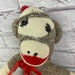 Vintage Sock Monkey With Red Nylon Ribbon at Neck and Pom Pom on Top of ...