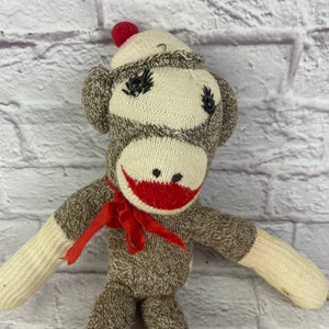 Vintage Sock Monkey With Red Nylon Ribbon at Neck and Pom Pom on Top of ...