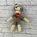 Vintage Sock Monkey With Red Nylon Ribbon at Neck and Pom Pom on Top of ...