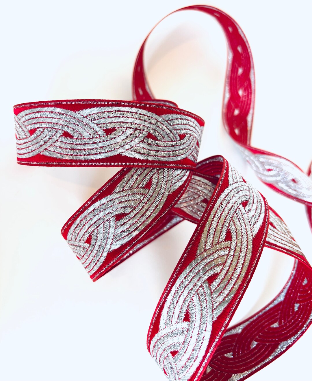 CELTIC BRAIDED KNOT Jacquard Trim, Silver on Red. Sold by the Yard. 1 1 ...