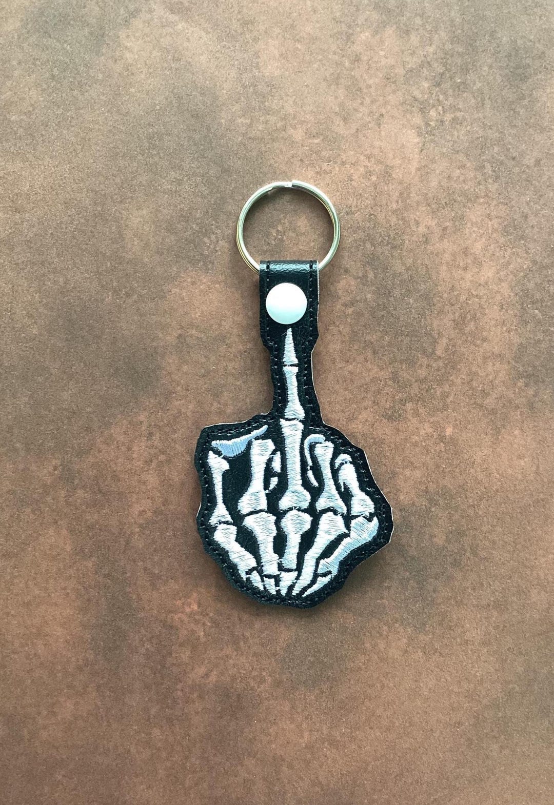 Skeleton Middle Finger Embroidered Faux Leather Keychain | Skeleton ...