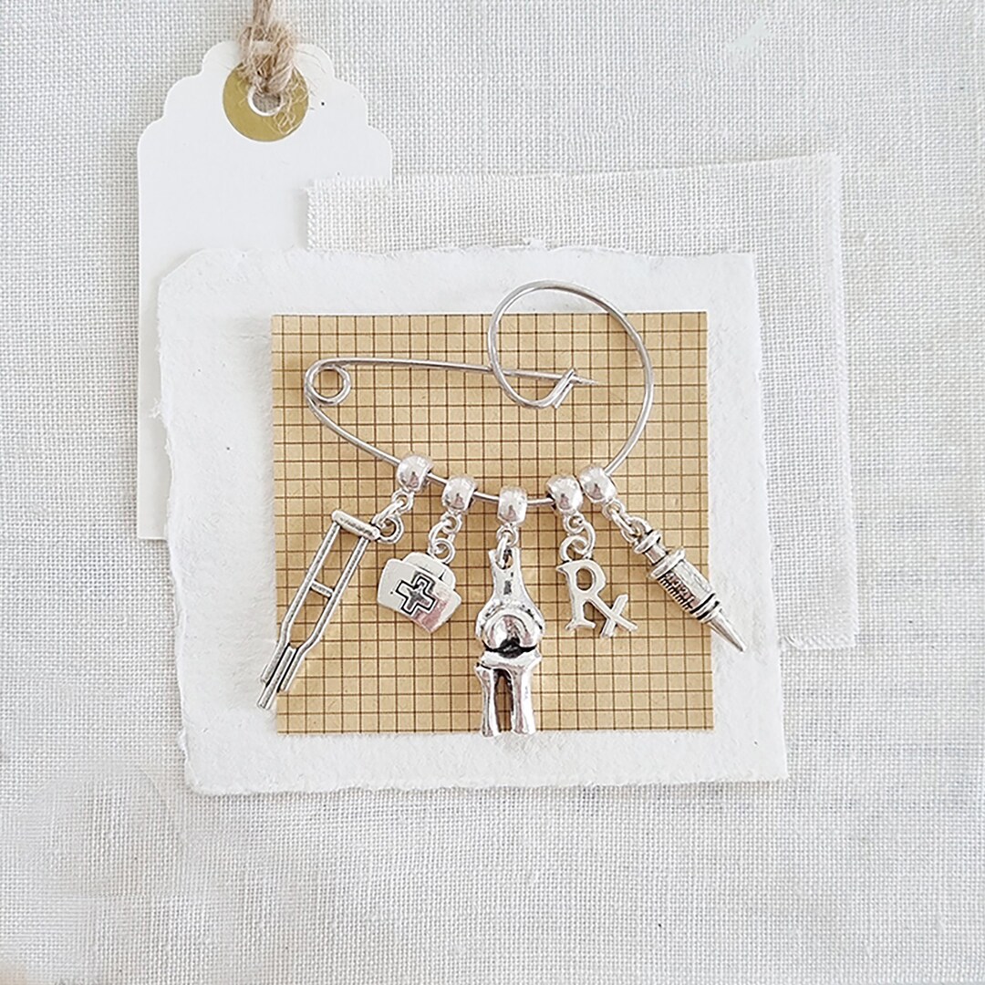 The Physio Swirl Pin is a Beautifully Detailed Charm Brooch Which Makes ...