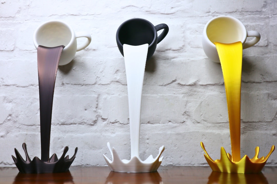 Gravity-defying Liquid Sculpture, Frozen in Time, a Cup Pouring Liquid ...