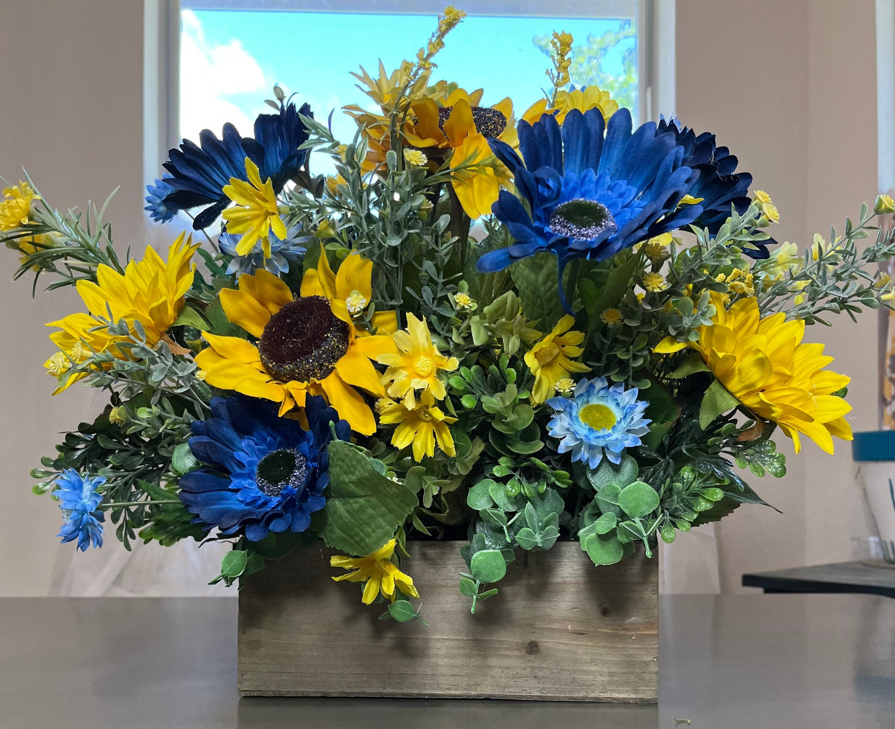 Blue Vase And Sunflower Centerpiece
