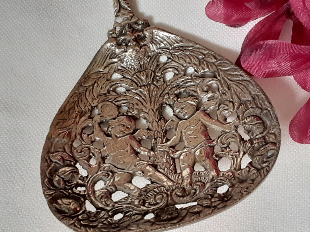 Cherub Spoon Ugo Bellini Repousse Spoon Italian Slotted Figural Cherub ...