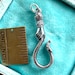 Jewelry Hook - Figural Hand Holding Serpent Hook - Snake Hook ...