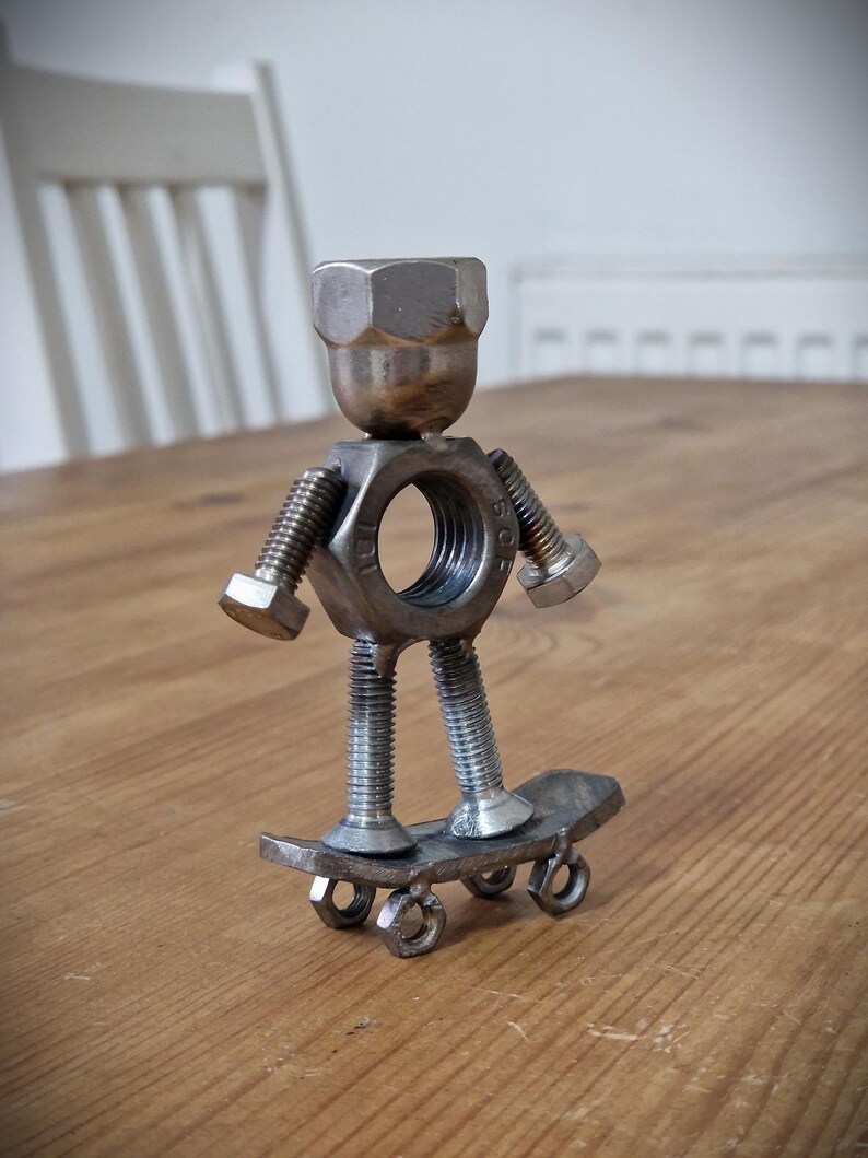 Handcrafted Metal Sculpture of A Person Skateboarding Made Using Nuts ...