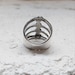 CAGED Ring - Etsy