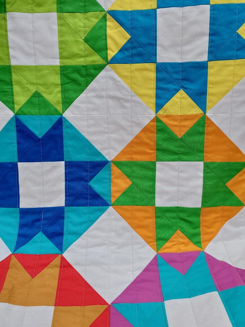 Bright Star Baby Quilt in Cheerful Solid Colors of the Rainbow Set on a ...