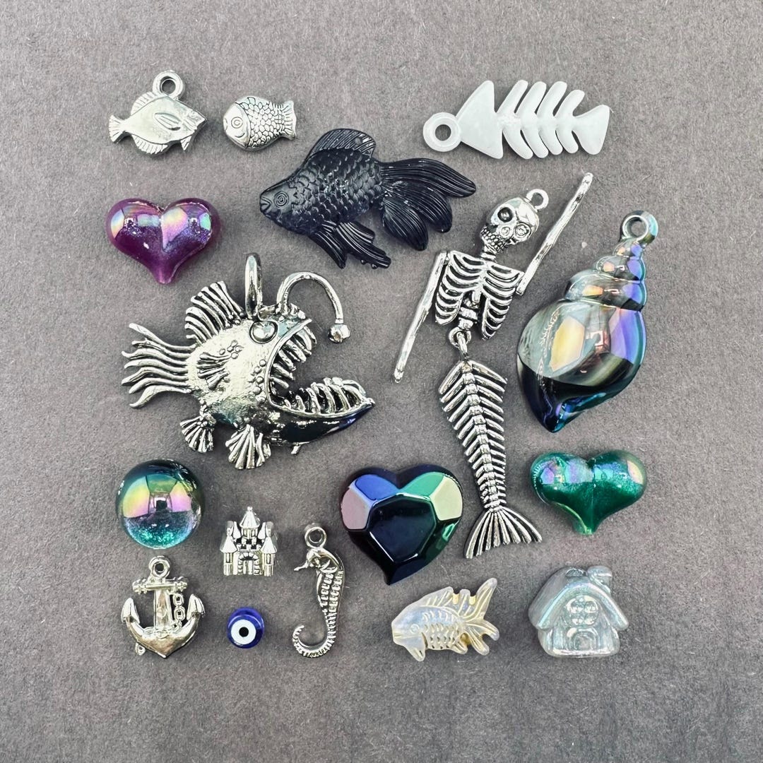A Deep Sea Gothic Collection of Charms, Beads, and Miniature Trinkets ...