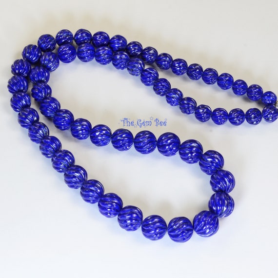 Carved lapis beads store