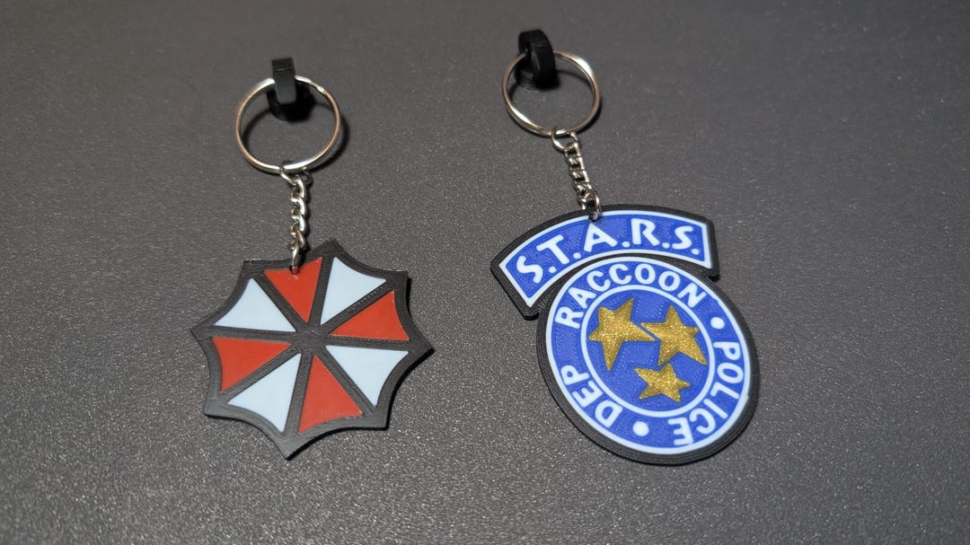 Resident Evil Keychain Set | Umbrella Corporation Logo & S.T.A.R.S ...