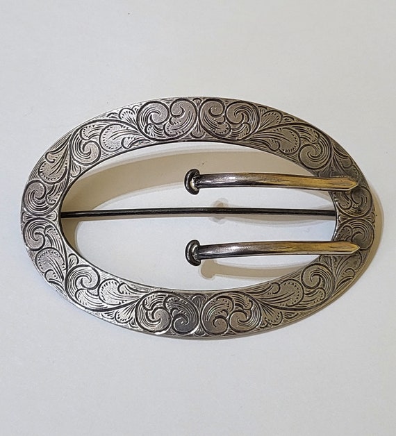 Buckle brooch store