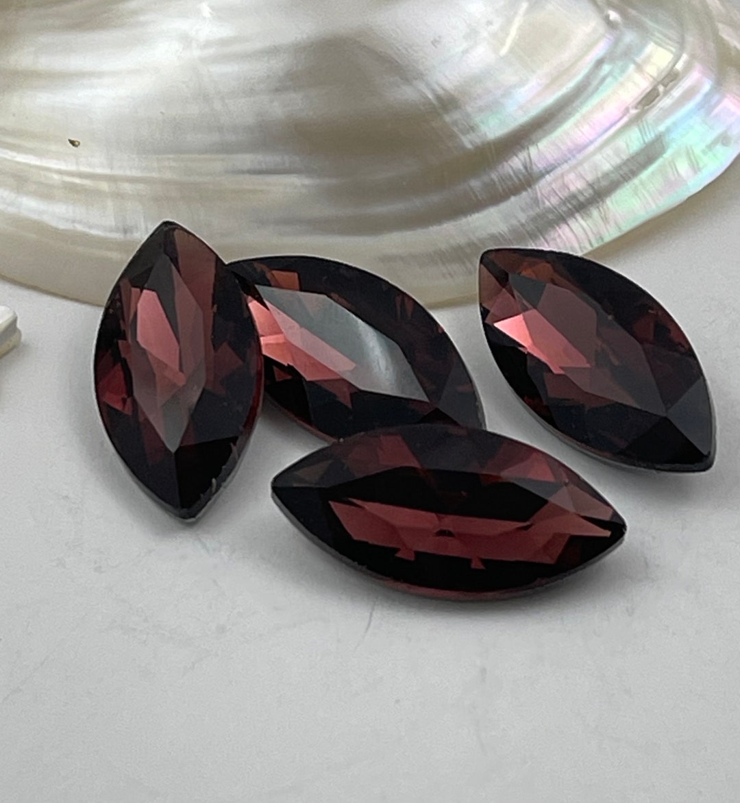 13x27mm Navette Shape Rivoli W/ Pointed Back. Dark Plum Color. 4 in a ...