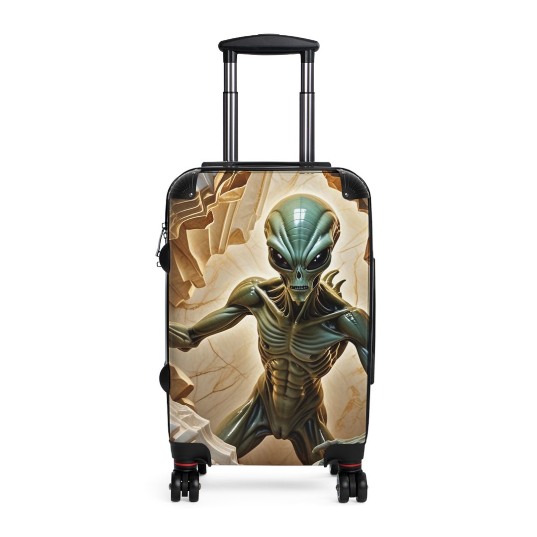Introducing the alien Busting Through Marble Wall Suitcase, a Unique ...