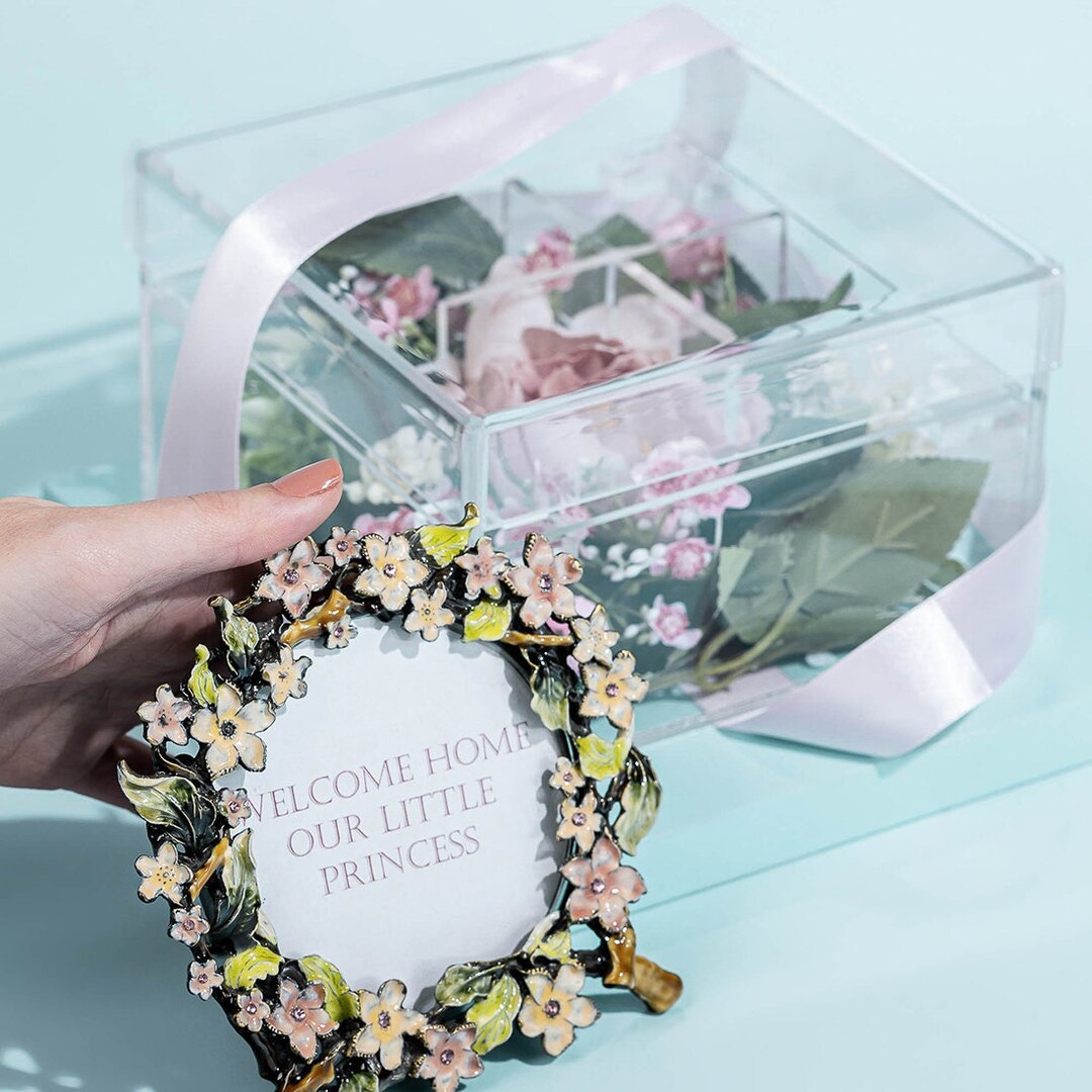 See-through Gift Box Filled With Flowers, Holding a Floral Frame With a ...