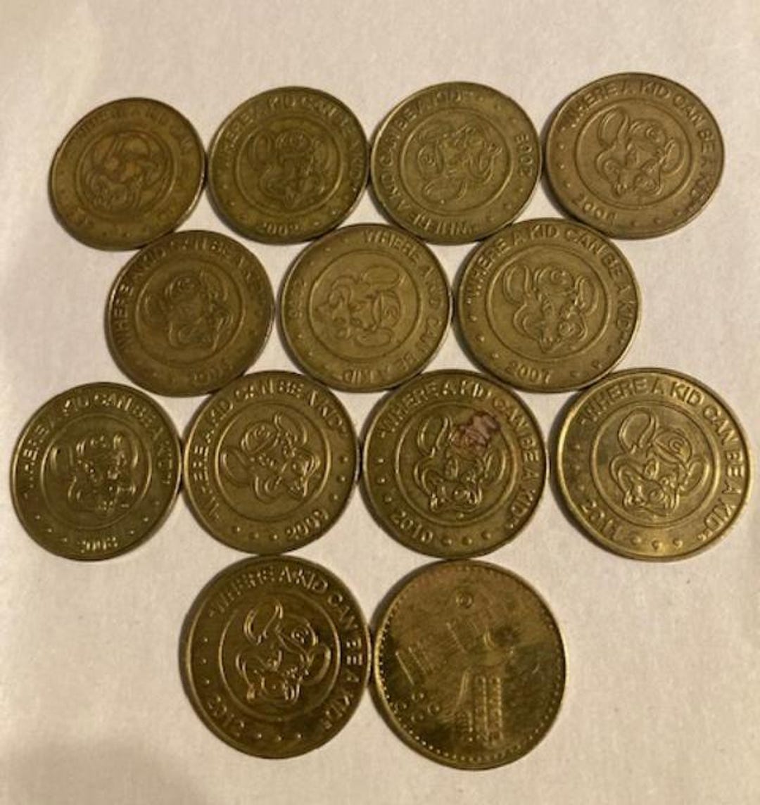 Chuck E. Cheese 13 Vintage Brass Tokens All Different Years 1997-2014 ...
