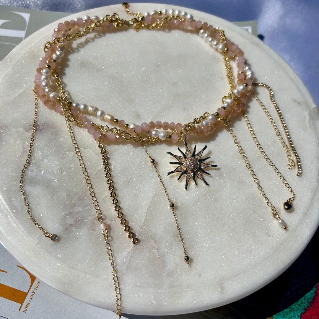 Elegant Tresor Sunburst Trio: Multi-strand Pearl Necklace With Pendant ...