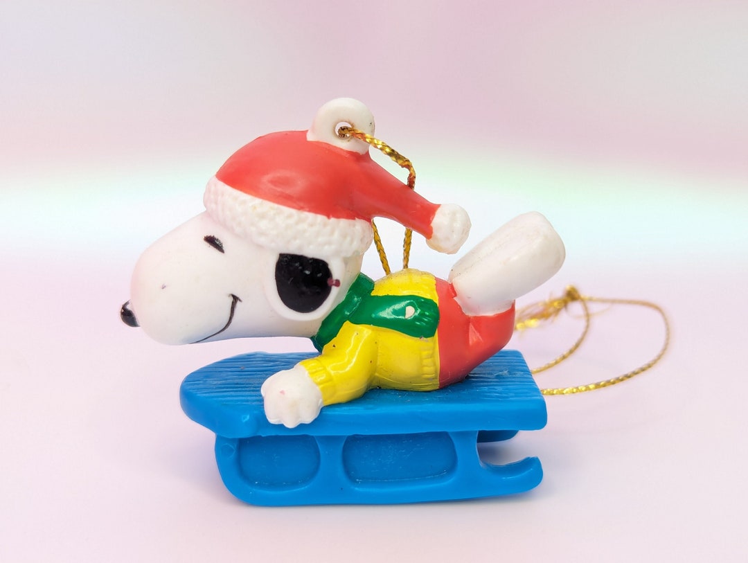 Peanuts Sledding Snoopy PVC Christmas Ornament Snoopy on a Blue Sled ...