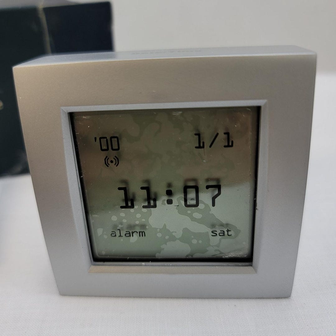 Brookstone Silver Upside Down World Clock Date Time Temp Alarm Battery ...