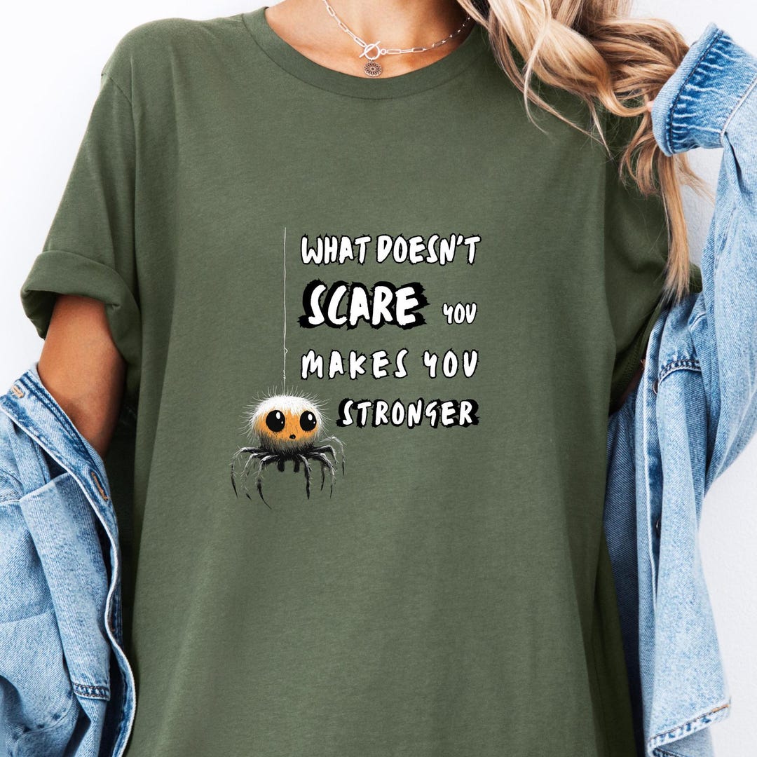 Motivational Shirt What Doesnt Scare You Makes You Stronger Funny Quote ...
