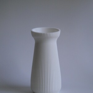 The Flair Vase: Features Elegant Ridges and a Unique Flared Top ...