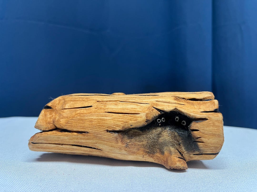 Sitting Handcrafted Whimsical Halloween Log Carvings With Peekaboo Eyes ...