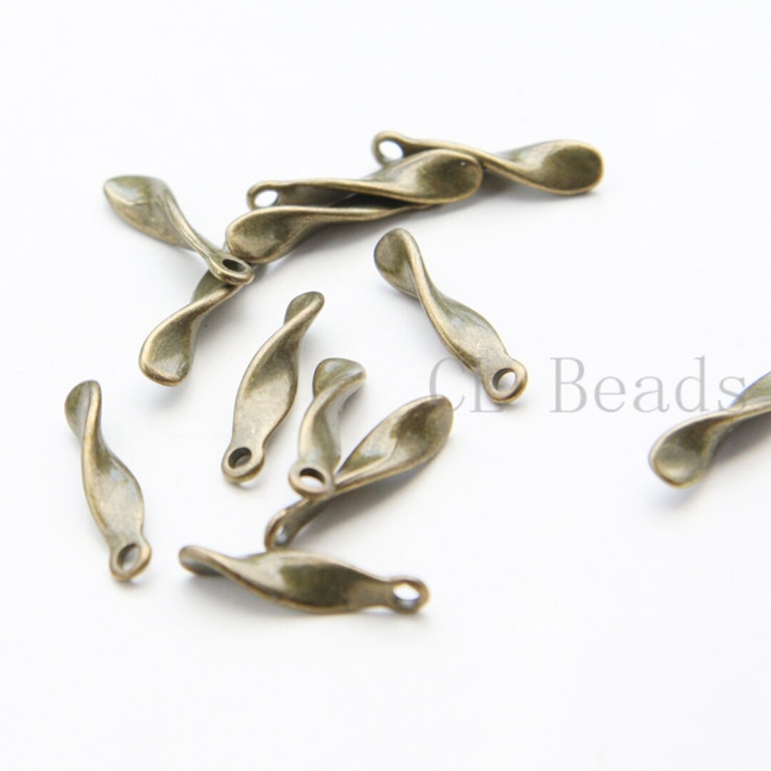 12 Pieces Antique Brass Tone Base Metal Charm - Whirl 19x4mm (26355Y-J ...