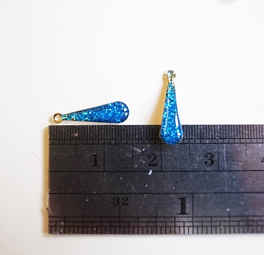 50 clear blue with glitters epoxy poly resin on gold color | Etsy