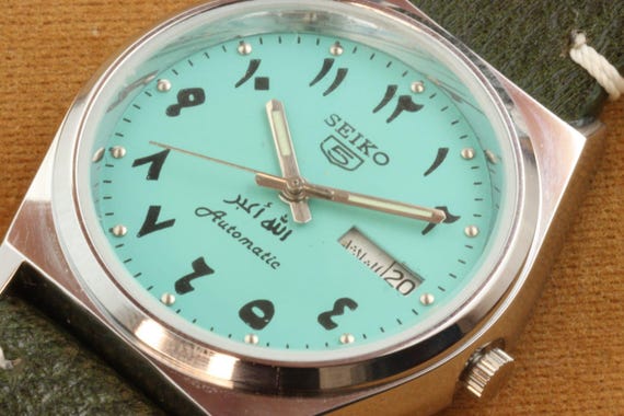 Vintage refurbished Seiko 5 turquoise arabic dial men… - Gem