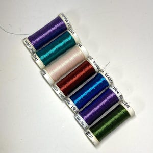 Collection of Seven Spools of Sulky Metallic Thread in Various Colors ...