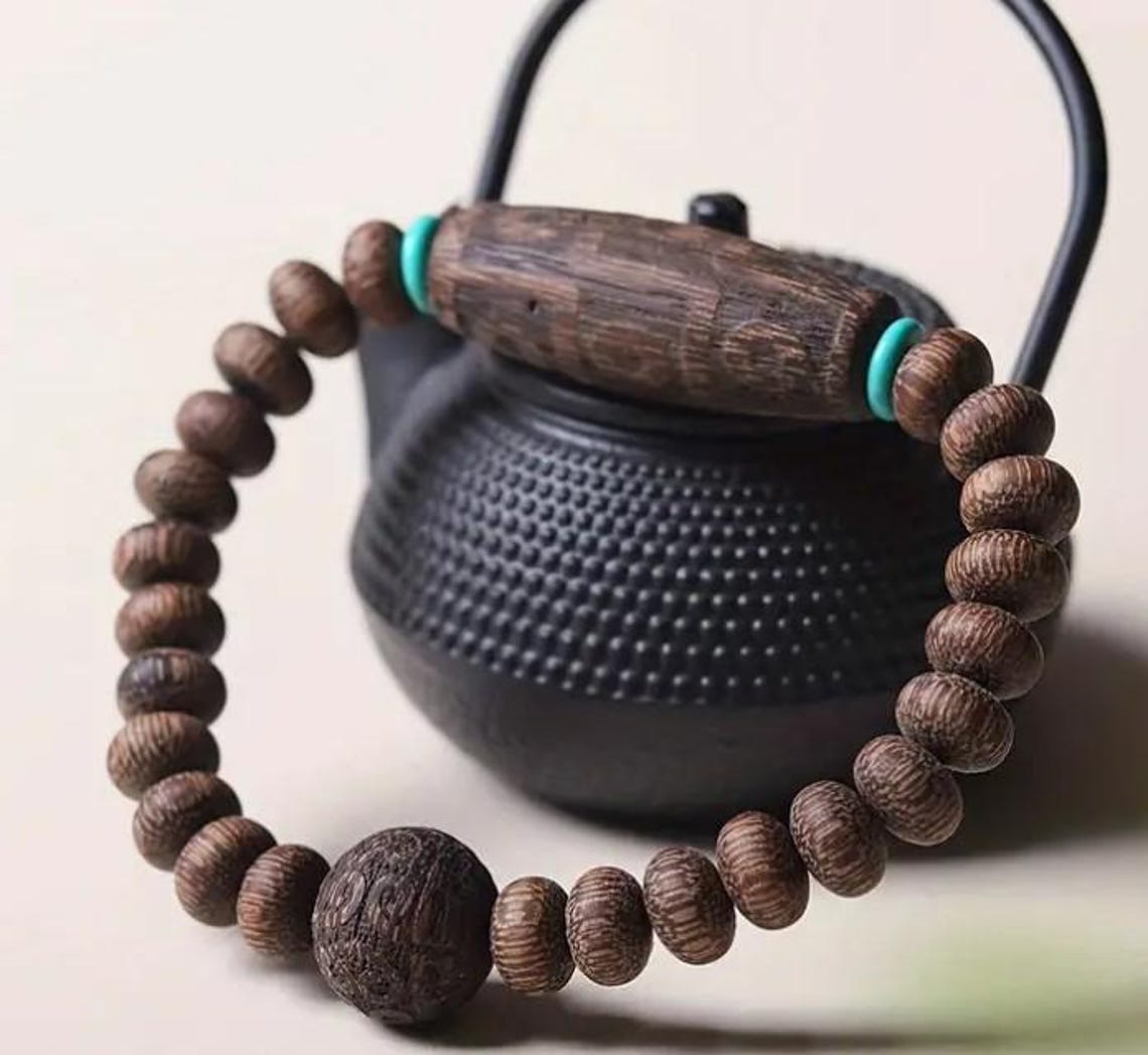 Handcrafted Wooden Bead Bracelet With Carved Charm, Turquoise Accents ...