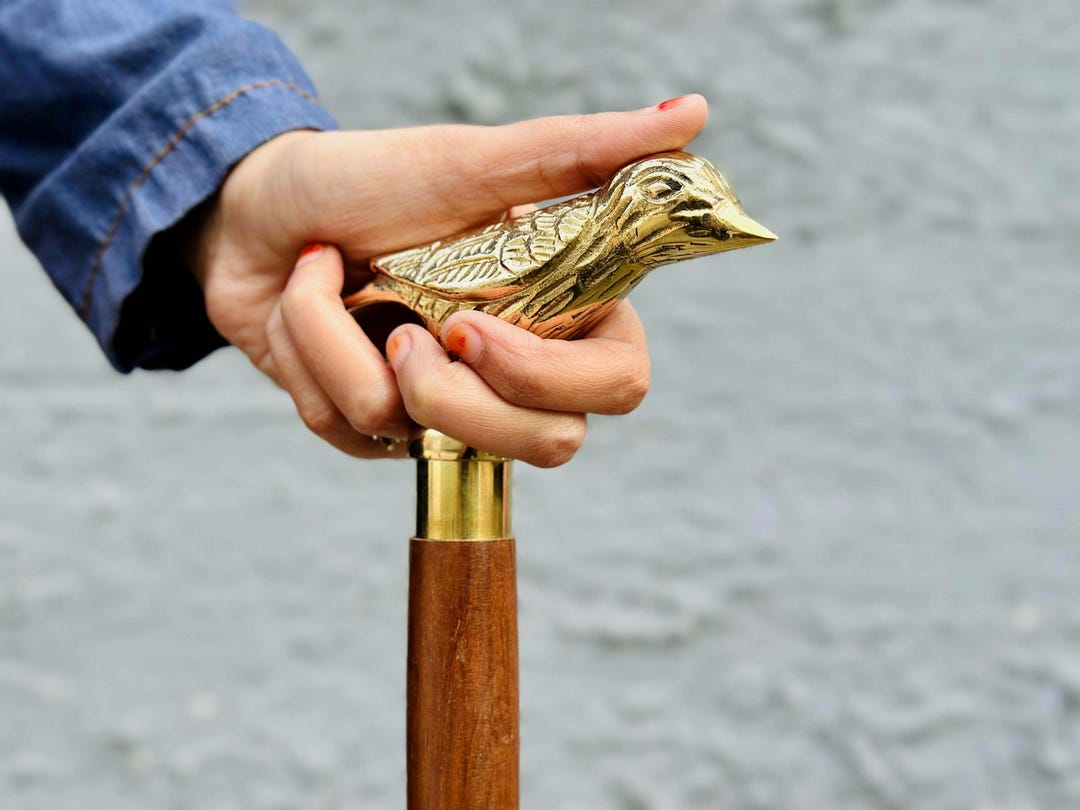 Take Fling With Our Golden Bird Handle Foldable Brown Wooden Stick ...
