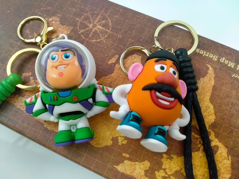 Toy Story Keychain in a Sea of Books Cartoon Character Keychain Toy ...