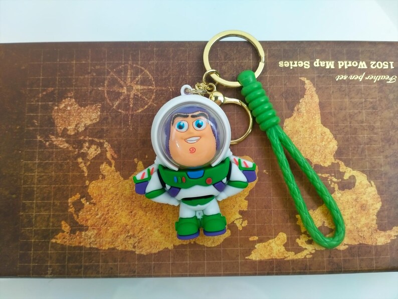 Toy Story Keychain in a Sea of Books Cartoon Character Keychain Toy ...