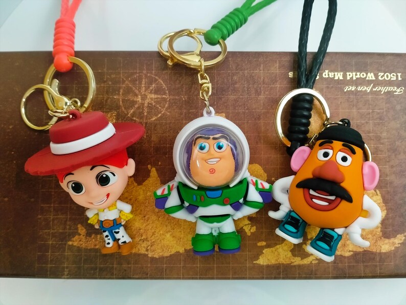 Toy Story Keychain in a Sea of Books Cartoon Character Keychain Toy ...