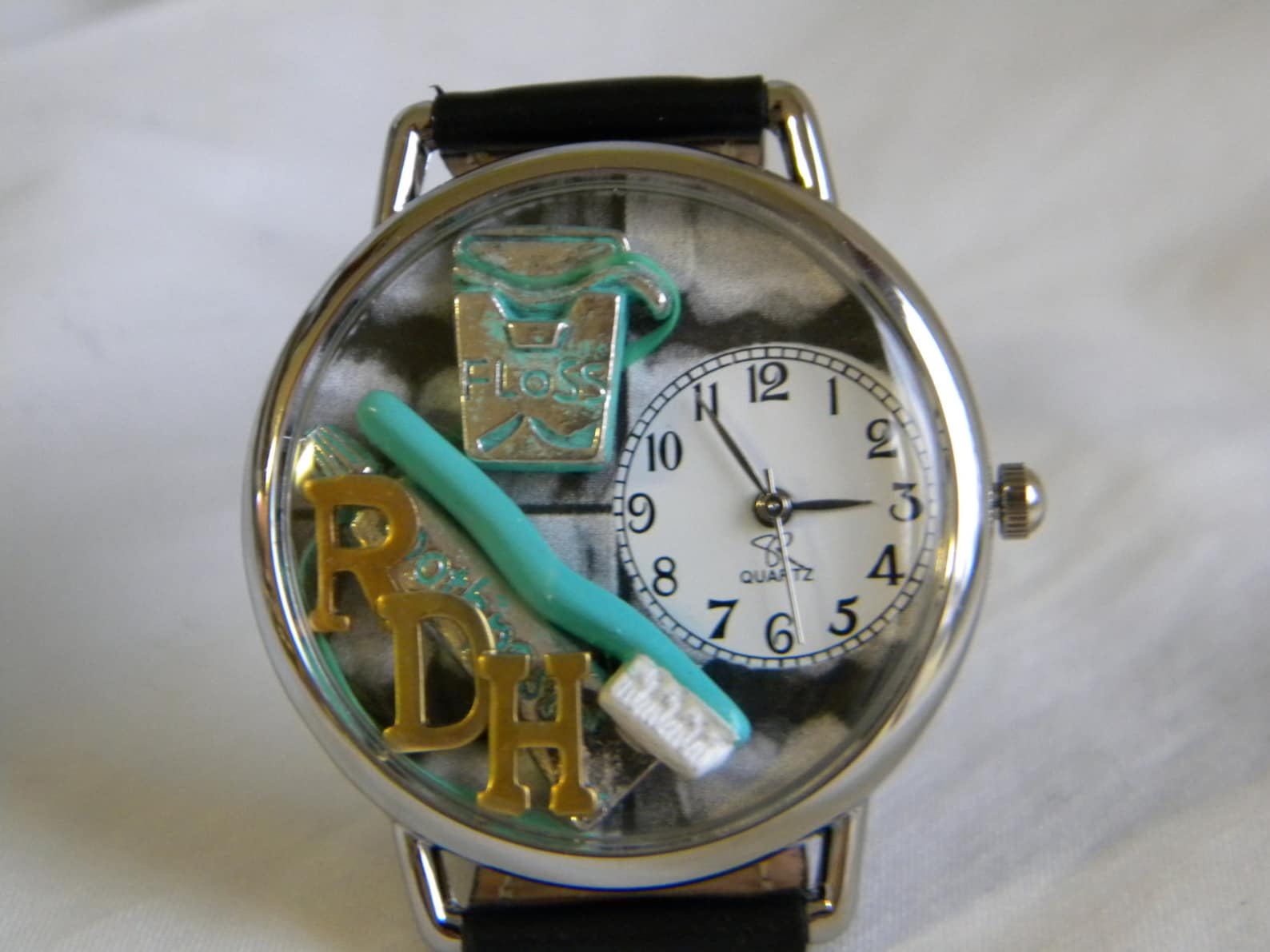 Dentist or Dental Hygienist Watch With Floss Toothbrush and Toothpaste ...
