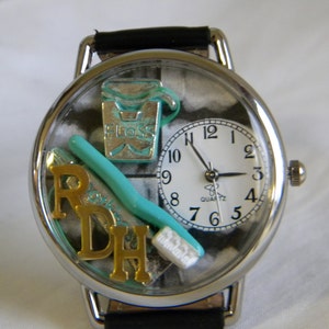 Dentist or Dental Hygienist Watch With Floss Toothbrush and Toothpaste ...