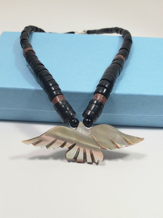 carved shell bird - Gem