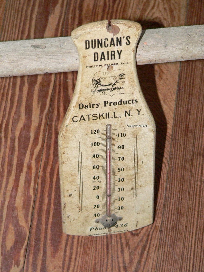 Termómetro antiguo de madera en forma de botella de leche Duncan's ...
