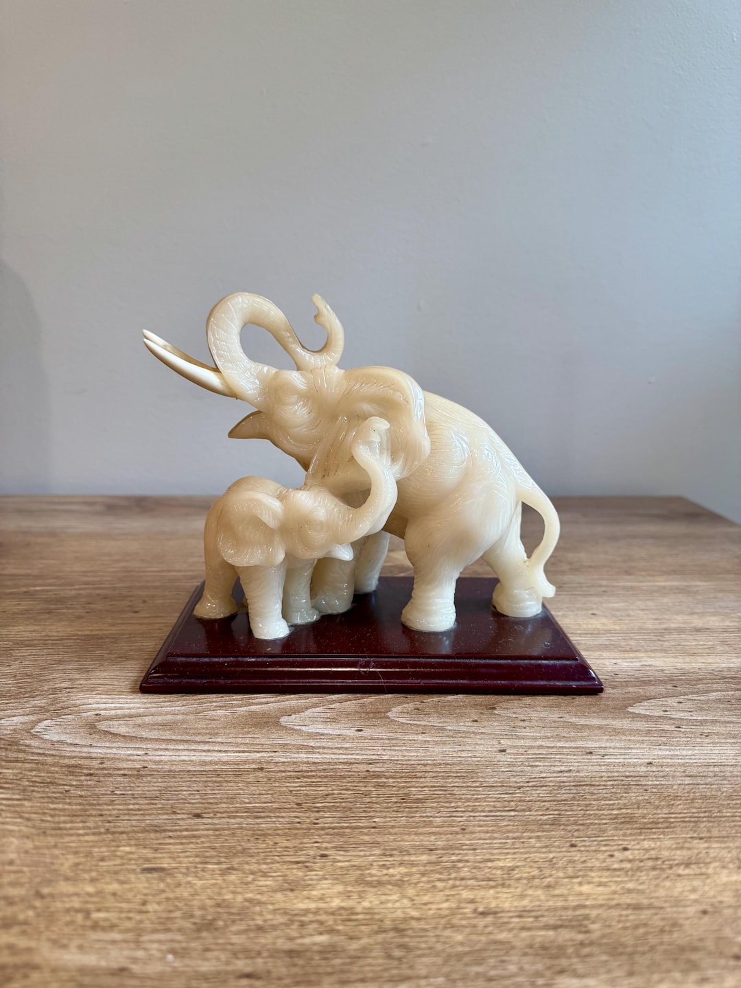 Vintage Celluloid Elephant Figurine: Mother and Baby on Wooden Pedestal ...