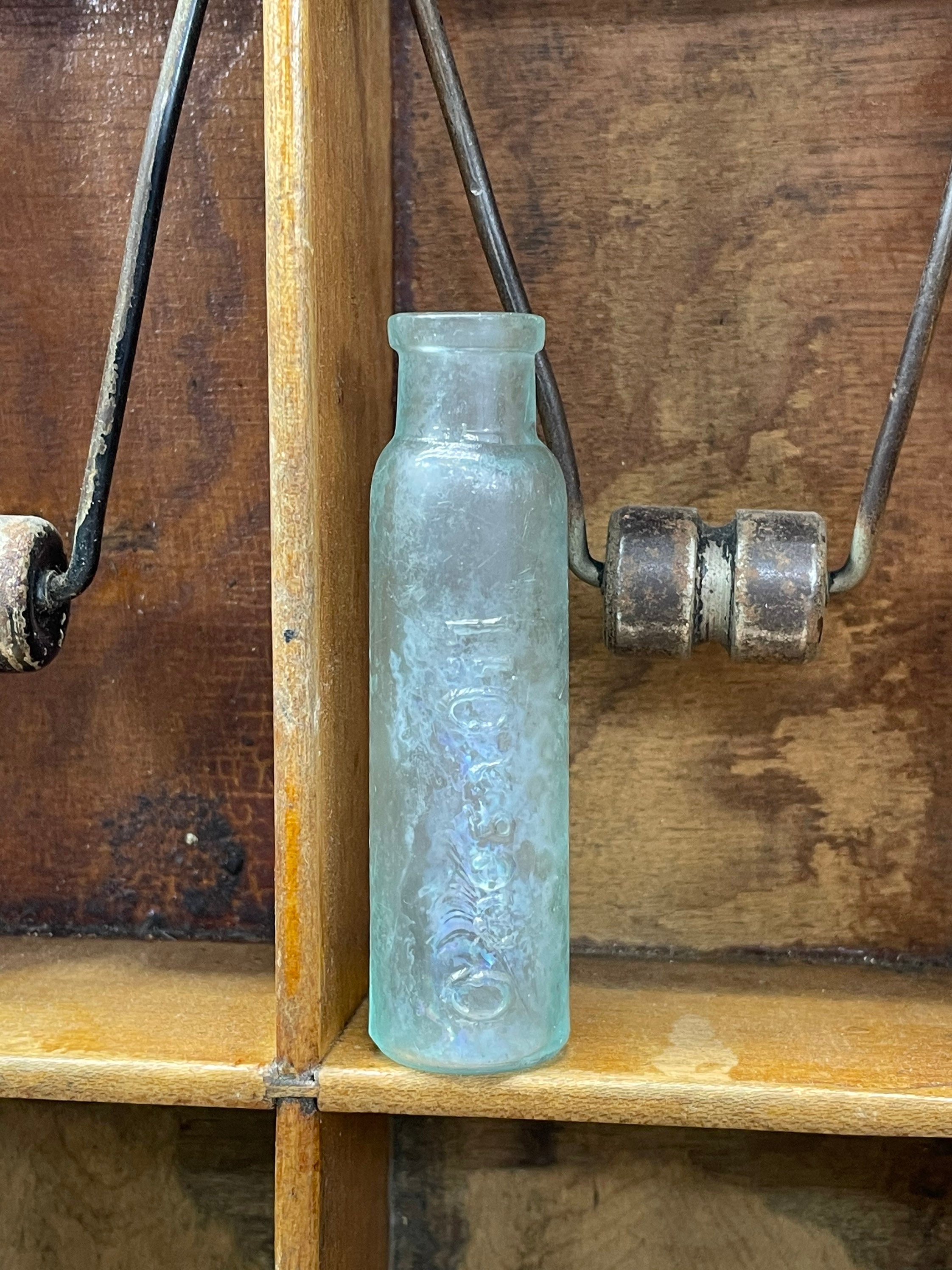 Omega Symbol Glass Bottle