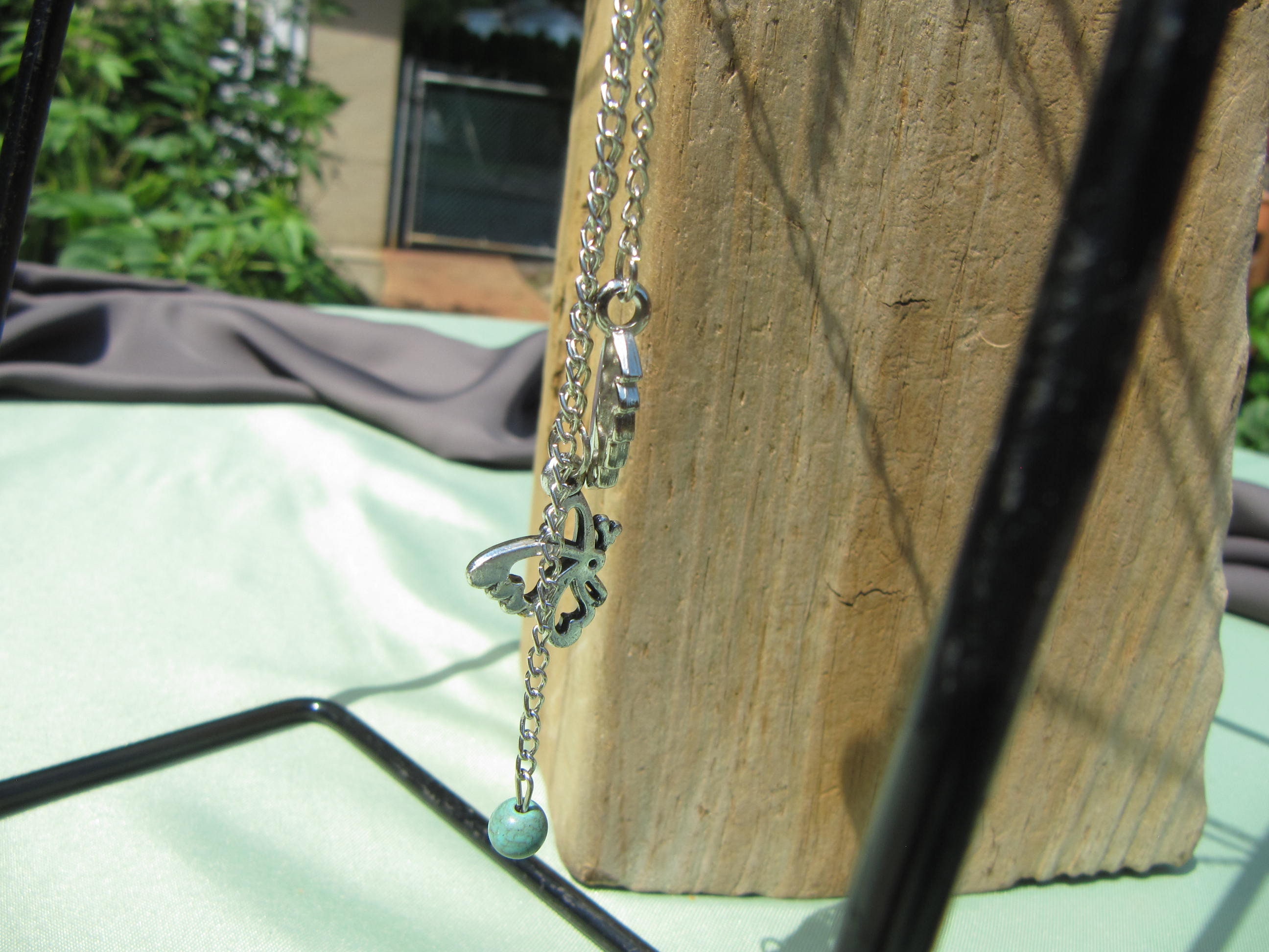 TURQUOISE CROSS and CHARMS on Silver Tone Chain, One in TURQUOISE CROSS and CHARMS on Silver Tone Chain, One in