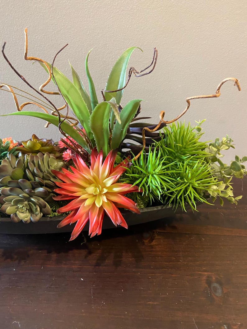 Contemporary Black Boat Shape Container Displaying Variety of Faux ...