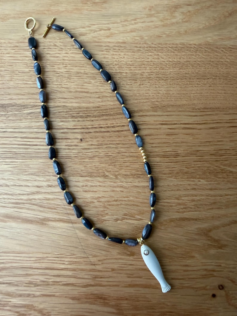 Navy Shell Bead Necklace With Pearl Colored Fish Pendant | Coastal ...