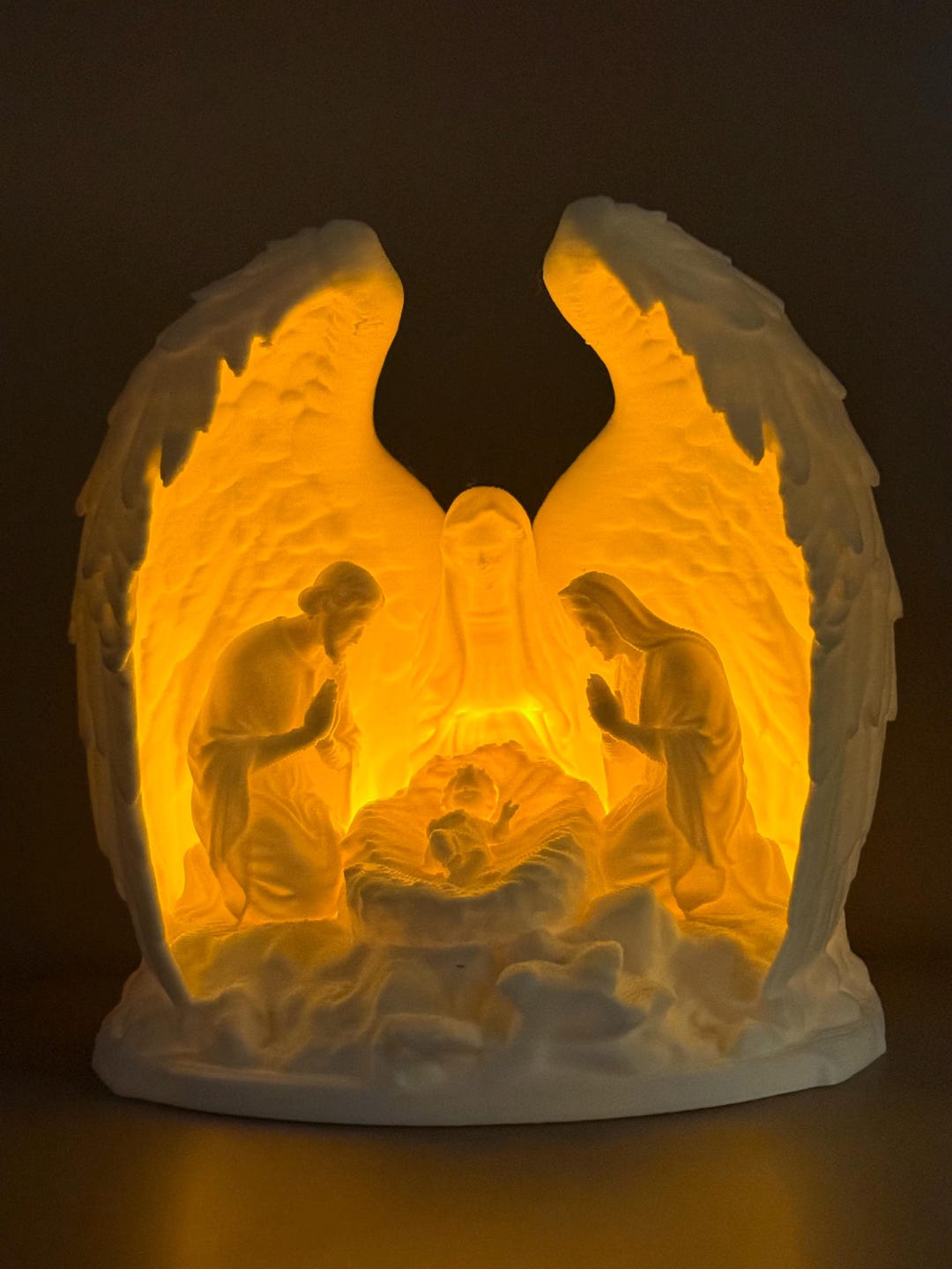 Illuminated Nativity Scene With Angel Wings Protecting Joseph, Mary ...