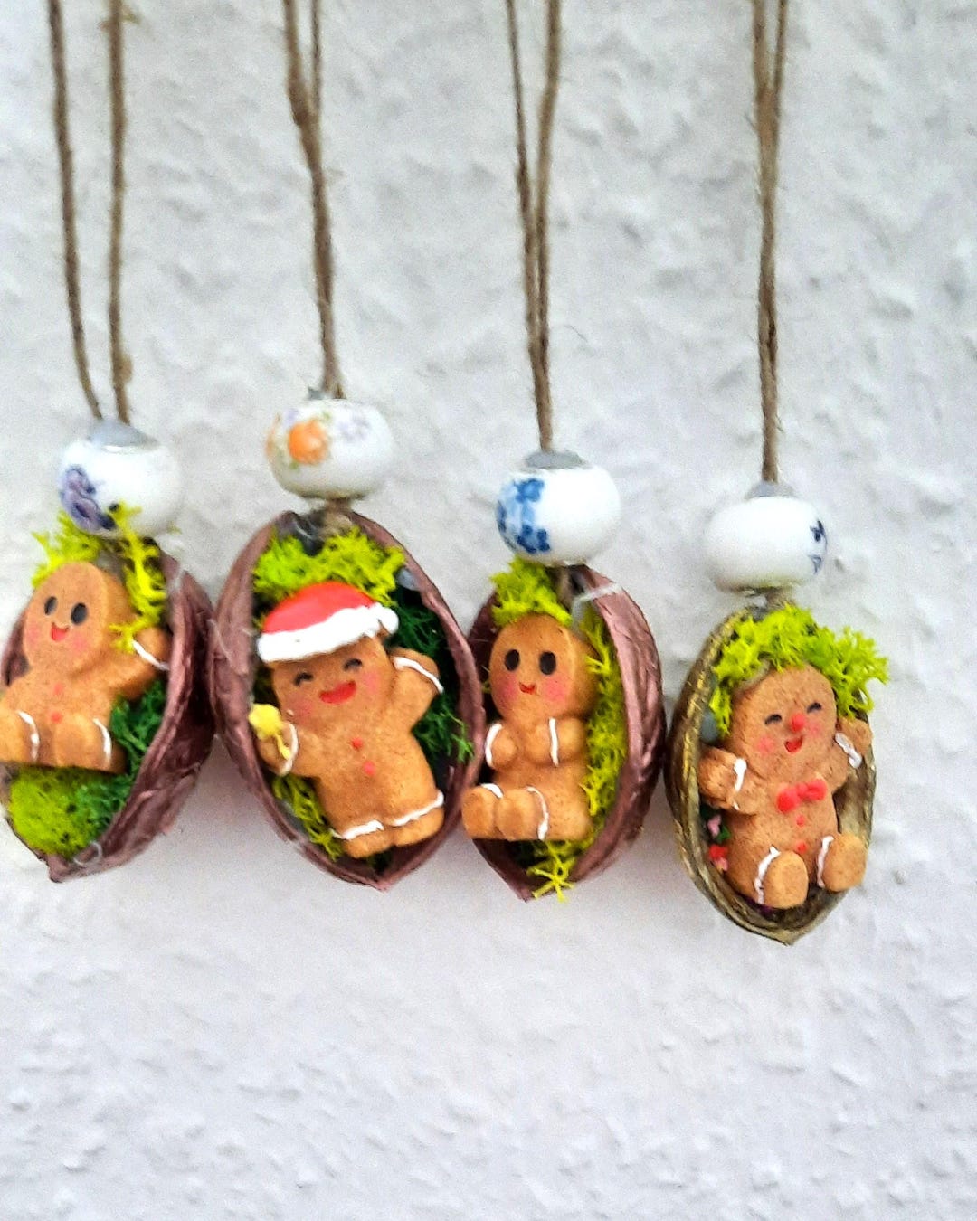 Walnut Shell Set With Miniature Gingerbread Men on Artificial Moss ...