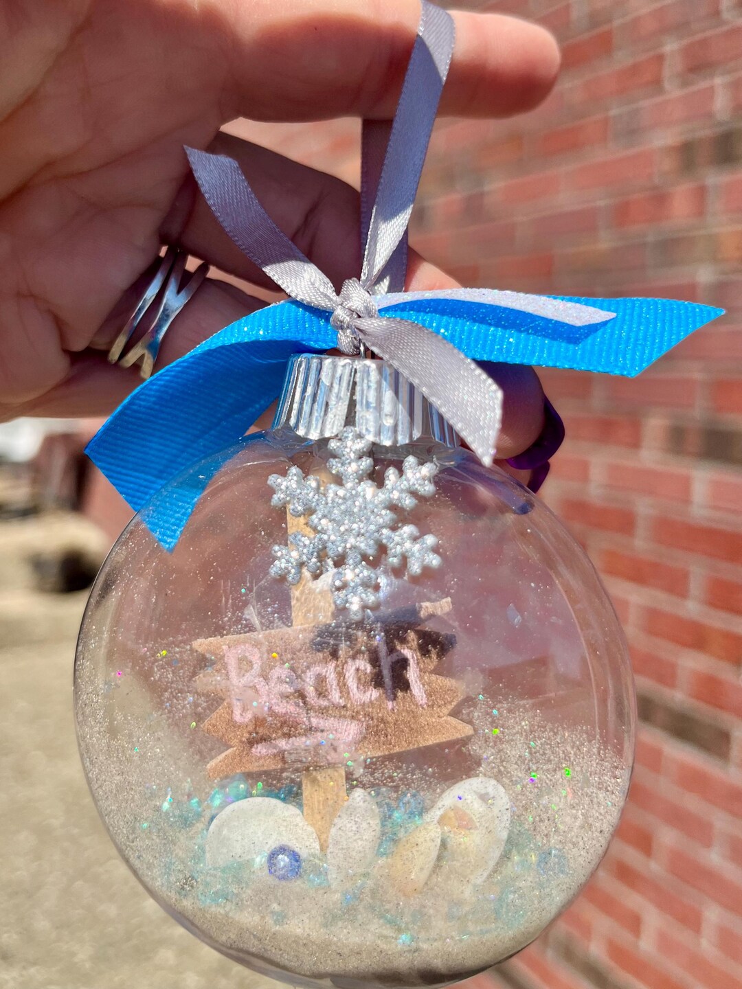 Coastal Charm: Bright Blue Ribbon-topped Beach Decorations for Your ...