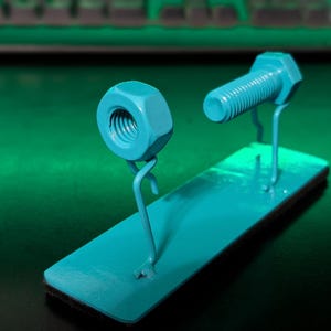 Bolt Chasing a Nut - Etsy